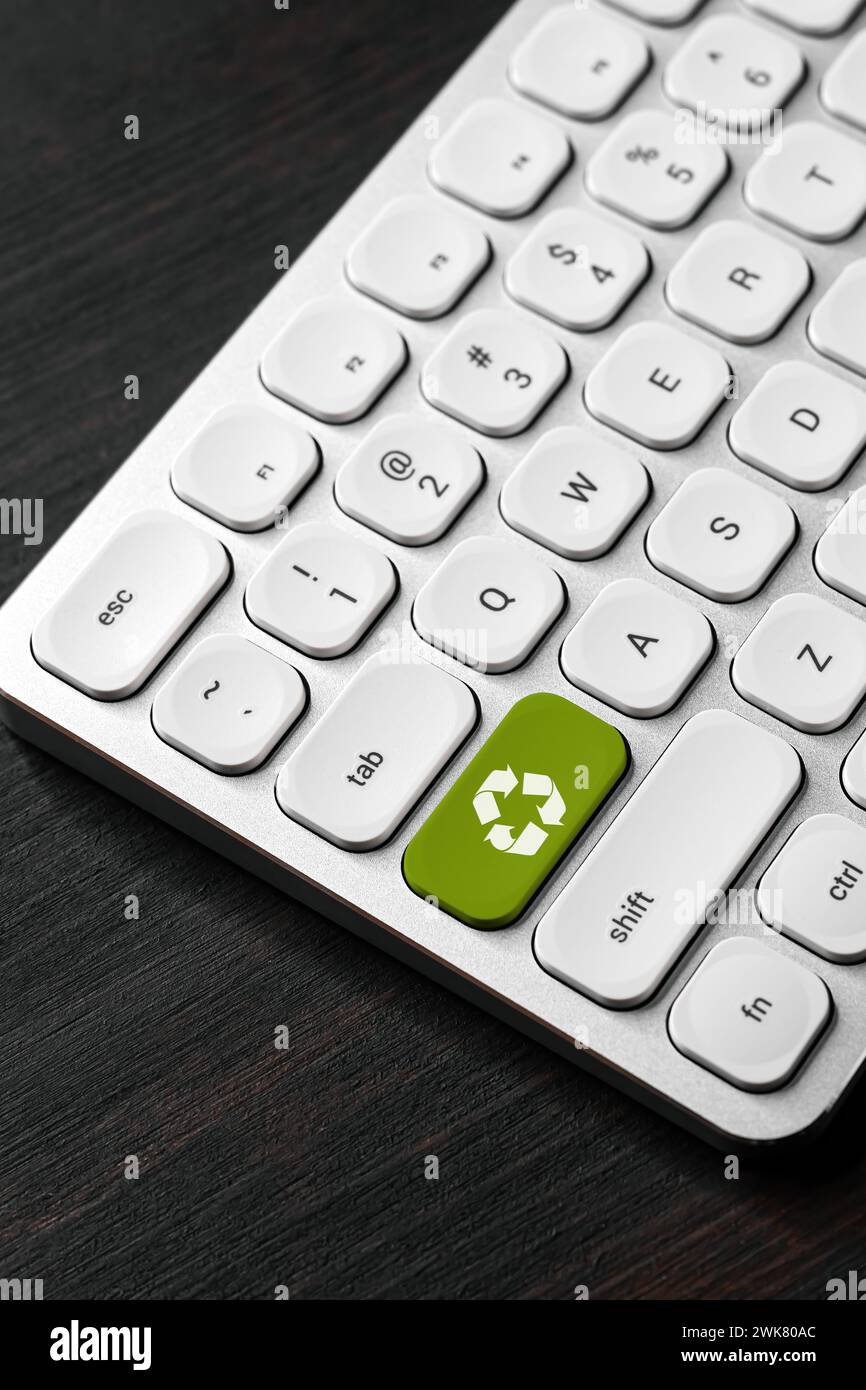 Recycling symbol on green computer keyboard key, selective focus Stock ...