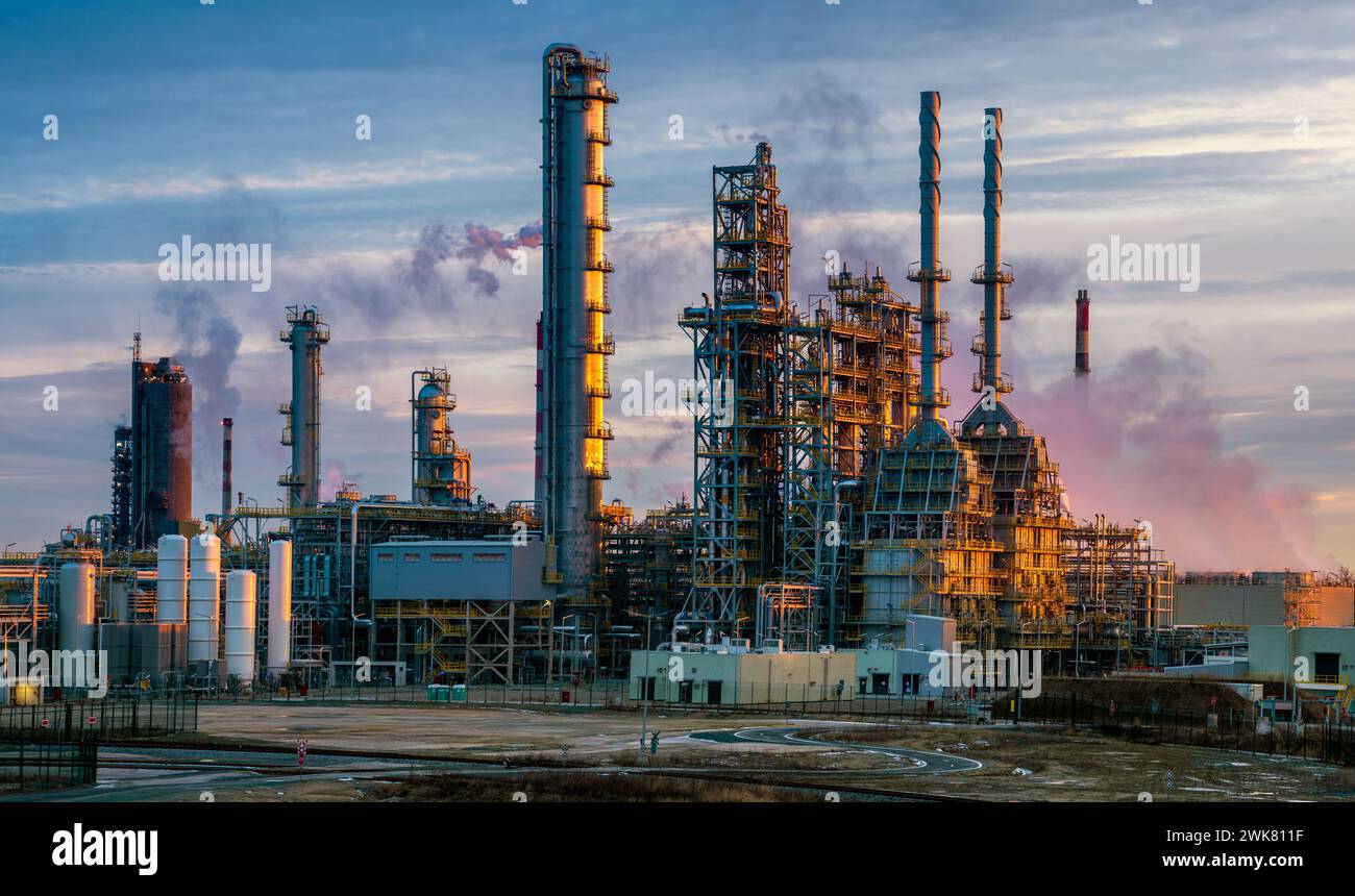 A modern, large polymer factory in Poland lit by the rising sun Stock ...