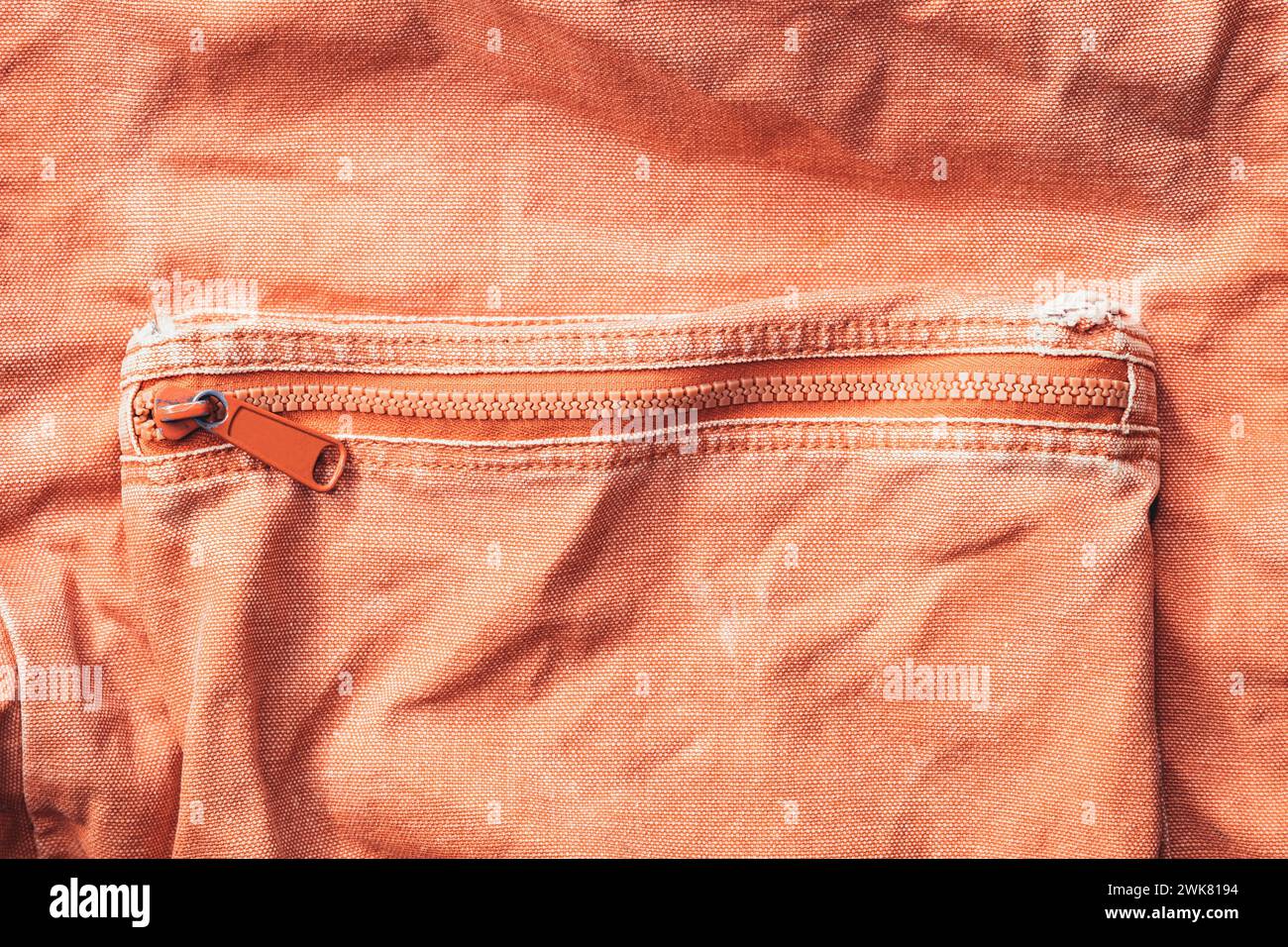 Old backpack pocket with worm zipper as background Stock Photo - Alamy