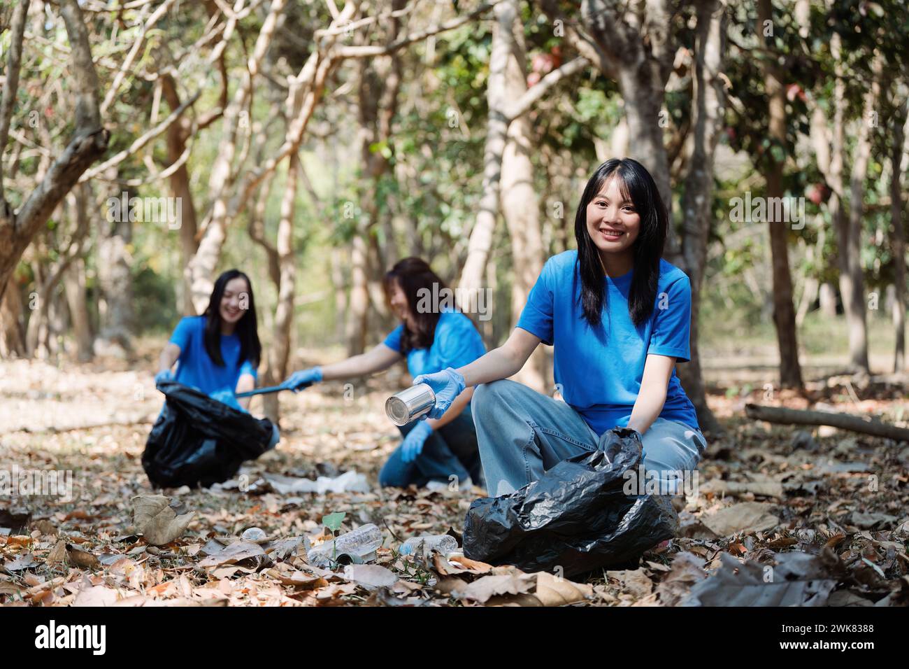 Group of volunteers, community members cleaning the nature from garbage ...