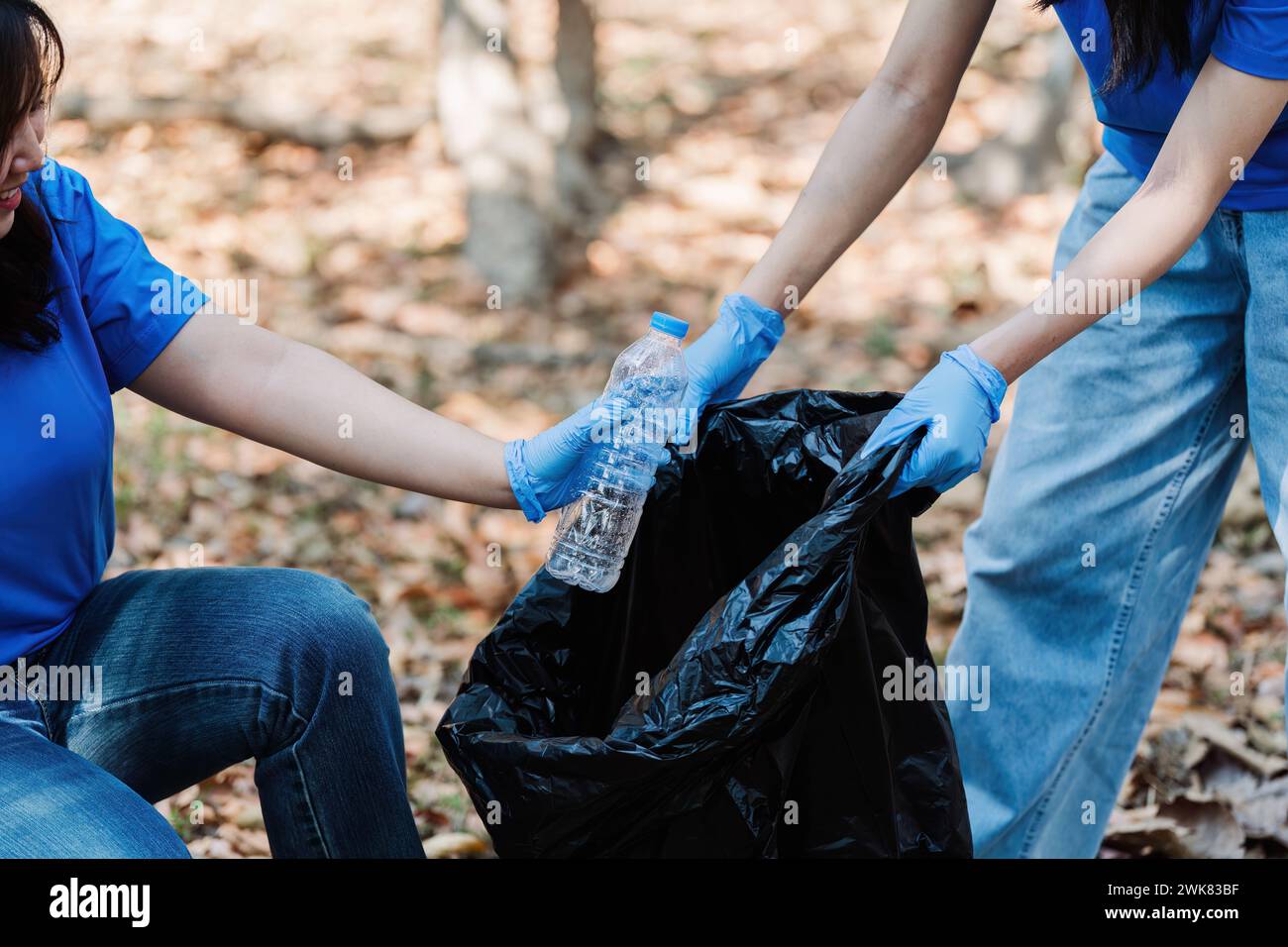 Group of volunteers, community members cleaning the nature from garbage ...