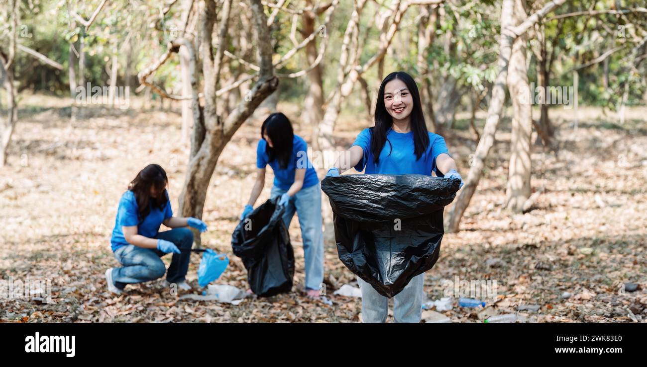 Group of volunteers, community members cleaning the nature from garbage ...