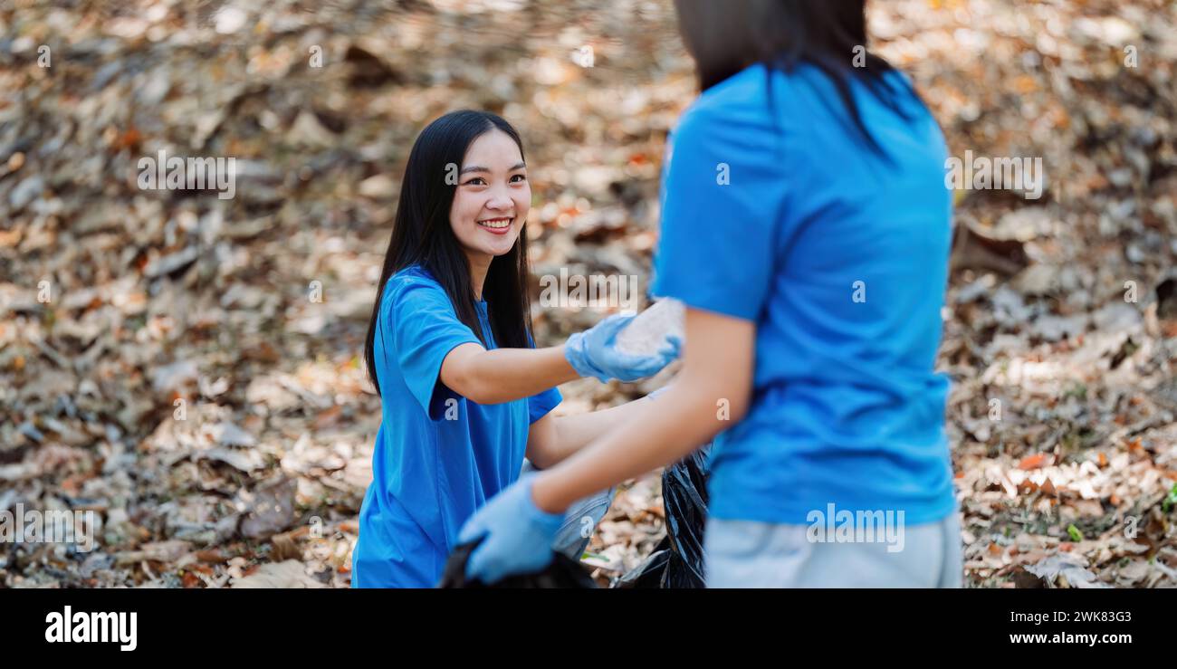 Group of volunteers, community members cleaning the nature from garbage ...