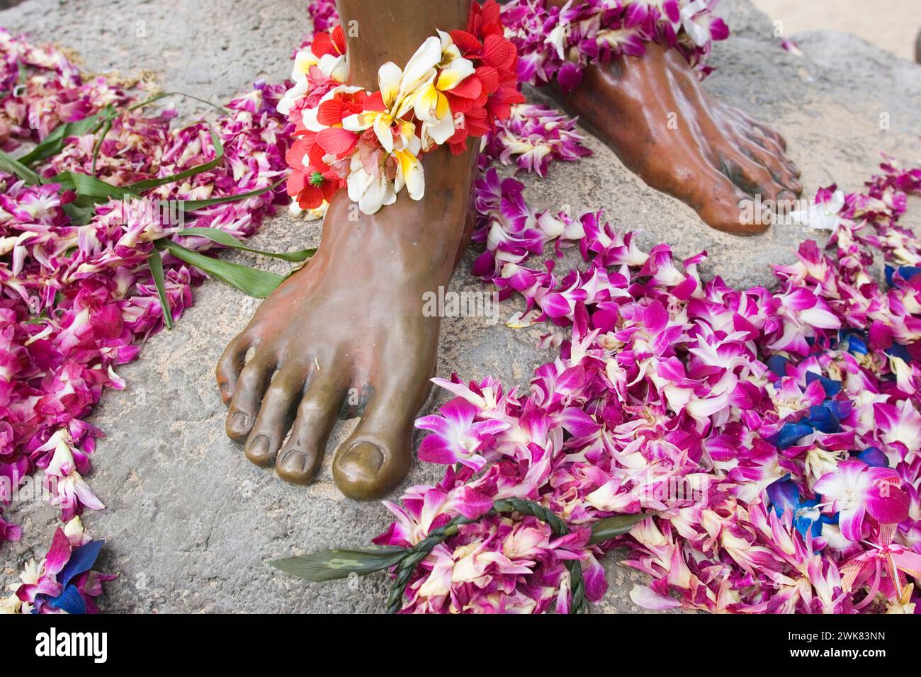 Flower leis at the feet of the statue of Duke Kahanamoku Stock Photo ...