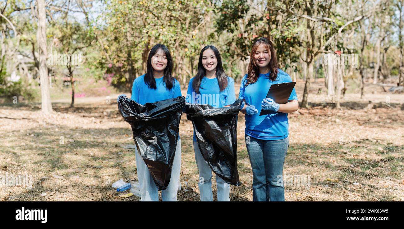 Group of volunteers, community members cleaning the nature from garbage ...