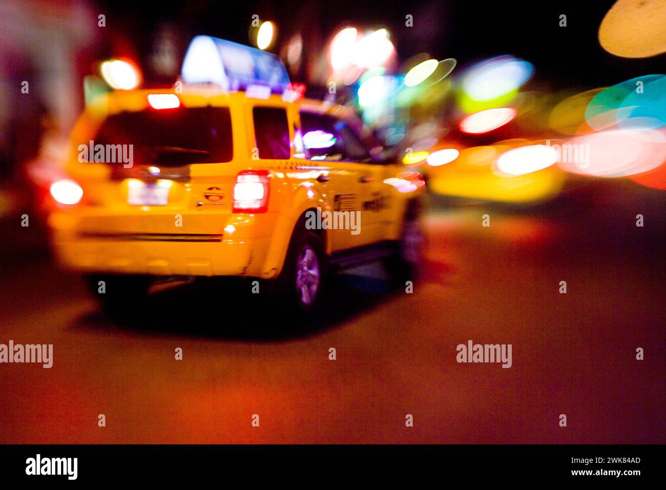 A hybrid taxi at night in Times Square, NYC Stock Photo - Alamy