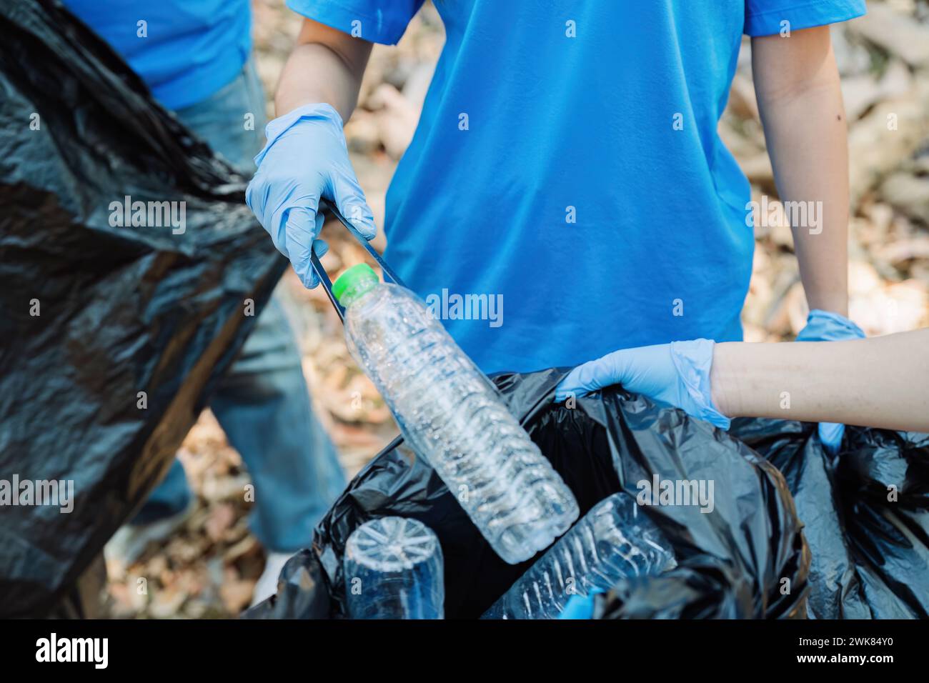 Group of volunteers, community members cleaning the nature from garbage ...