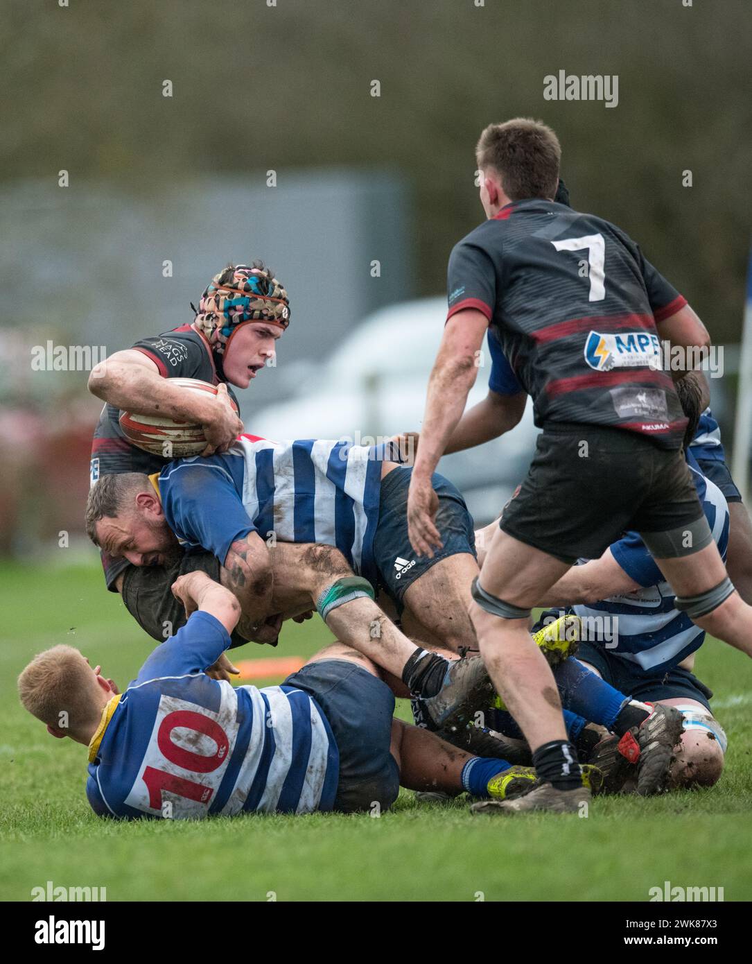 Male amateur rugby union football players playing a game of rugby and ...