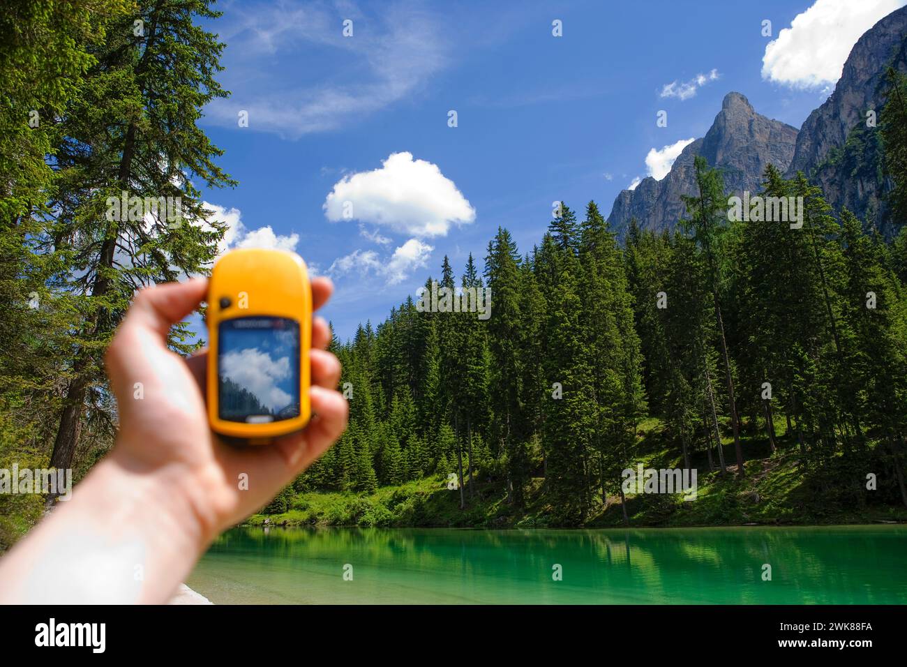 Hand Holding GPS, Lago di Braies, South Tyrol, Italy Stock Photo - Alamy