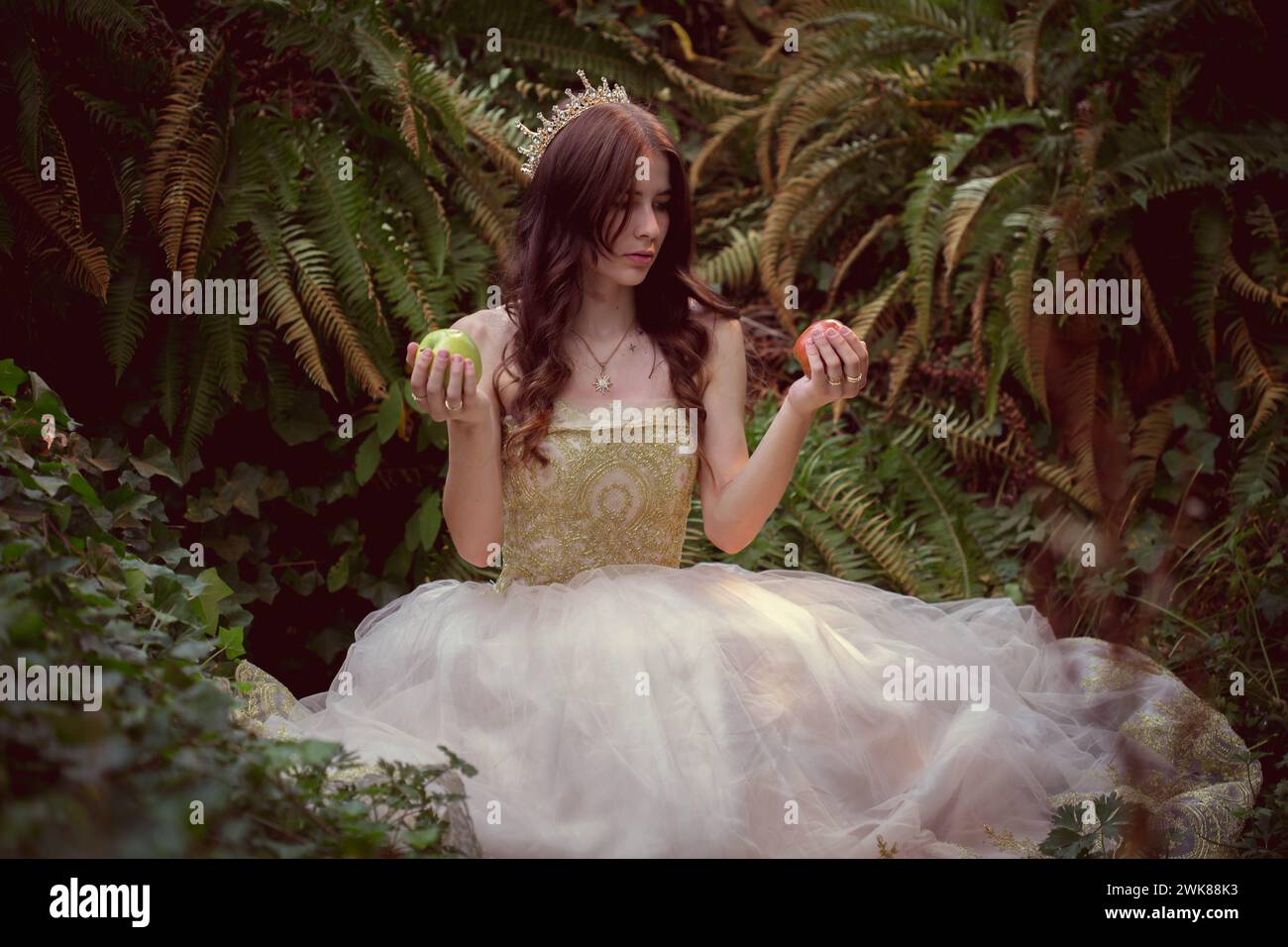 princess in forest choosing between two apples Stock Photo - Alamy