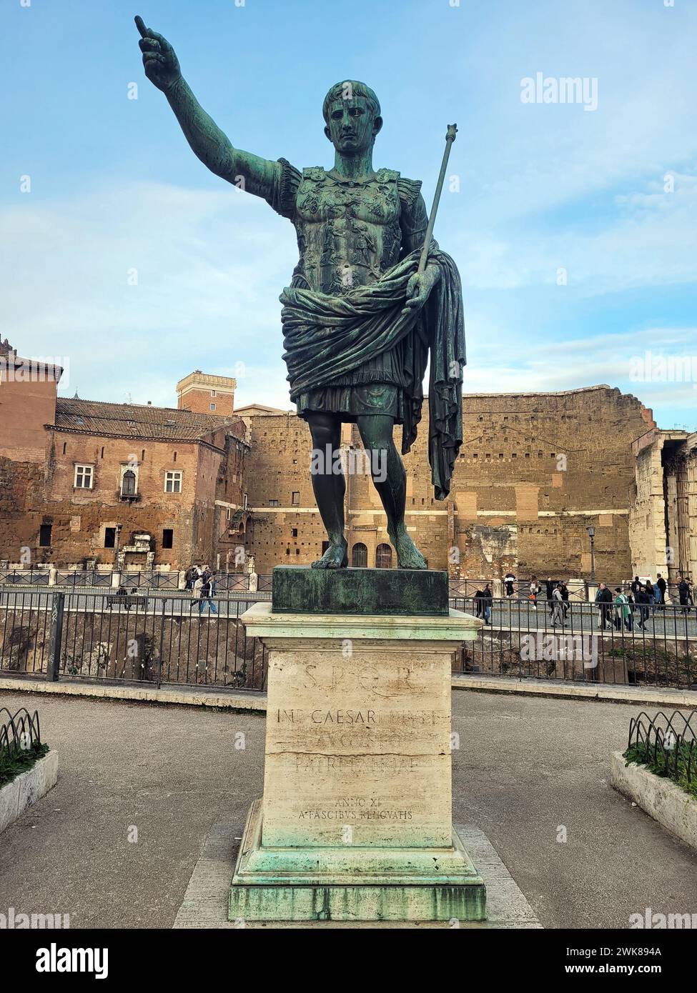 A bronze statue of a Roman Emperor pointing towards the sky, located on ...