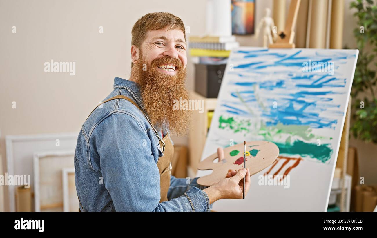 Smiling young redhead man radiating confidence, drawing away blissfully ...