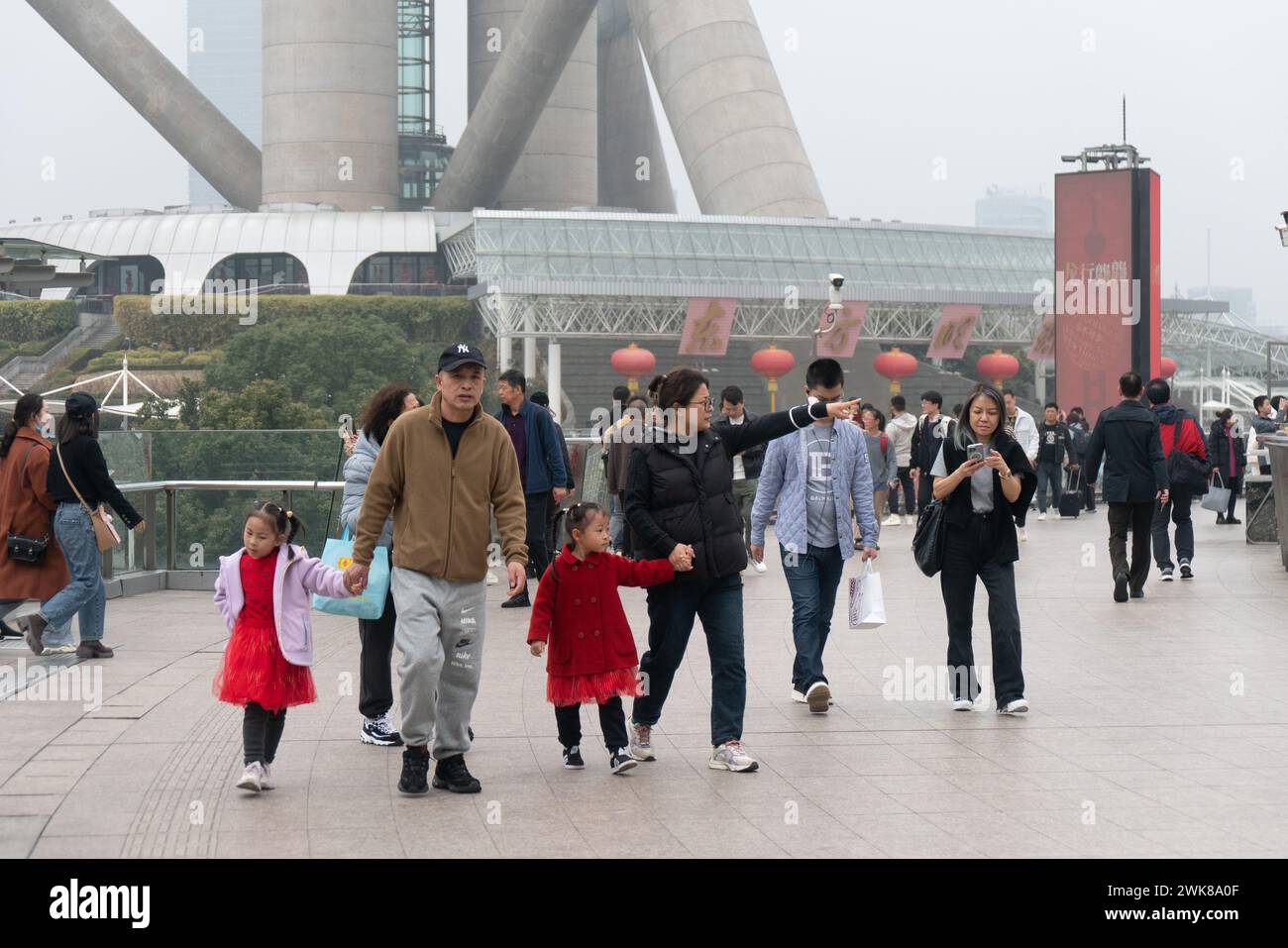 SHANGHAI, CHINA - FEBRUARY 19, 2024 - A two-child family travels on the ...