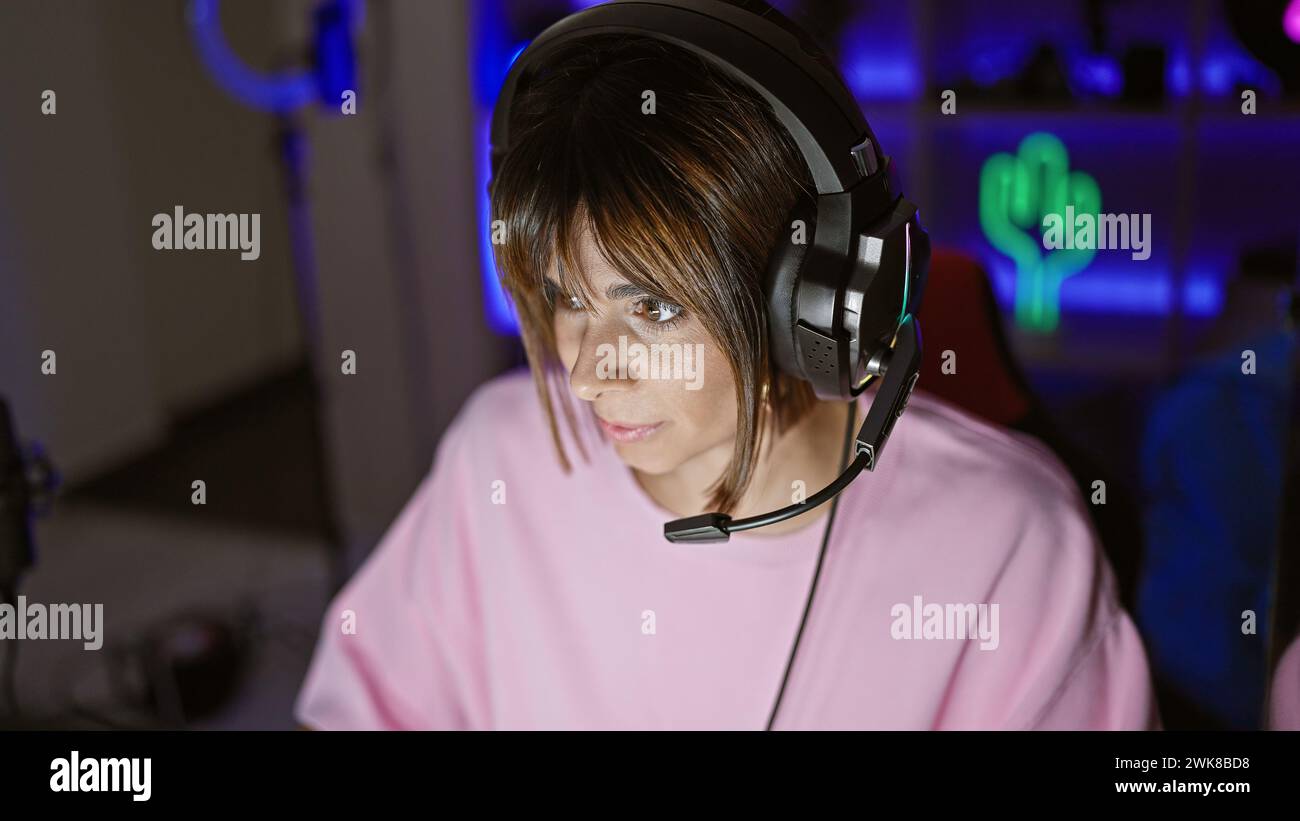 Radiant young hispanic woman streamer, engaging in gaming nirvana ...