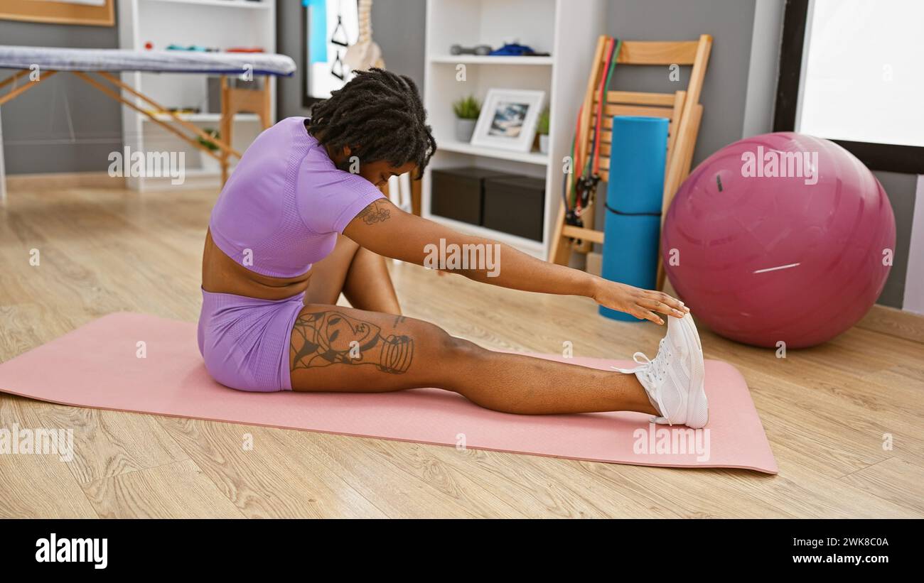 Focused african woman stretching hi-res stock photography and images ...