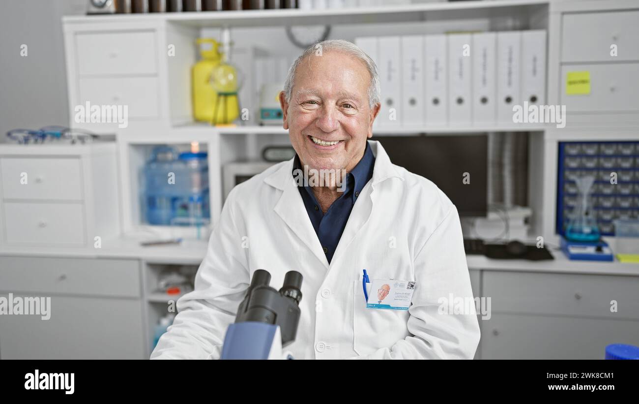 Confident elder scientist with grey hair, smiling joyfully amidst the ...
