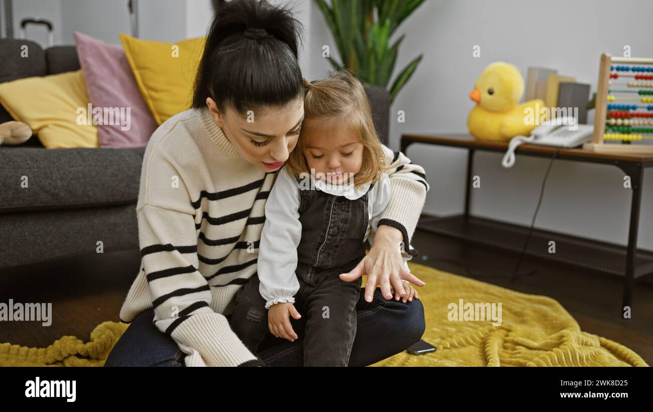 Woman and girl, presumable mother and daughter, share a heartwarming ...