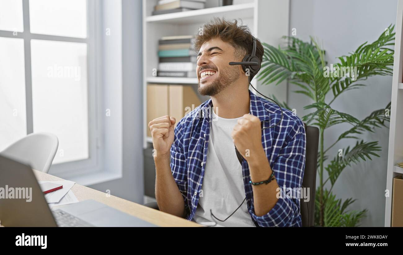 Winning at work, young arab man, a professional worker, radiating ...