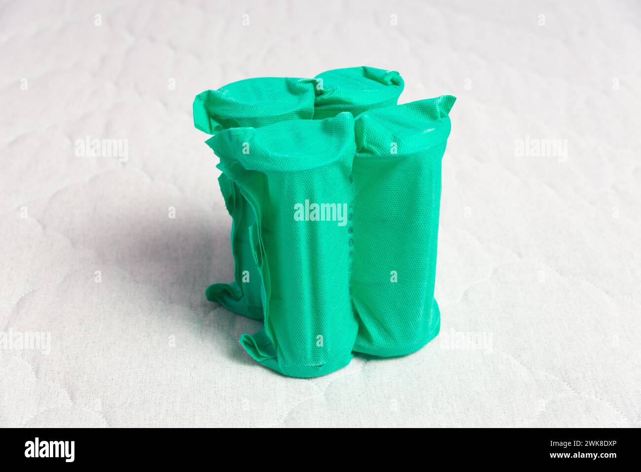 Independent spring block packed in green spunbond. Bonding layers of ...