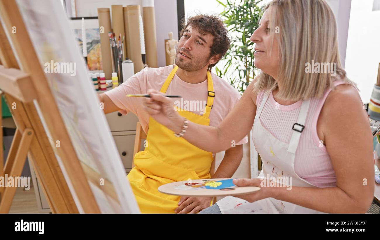 In the heart of creativity, two confident artists, man and woman ...