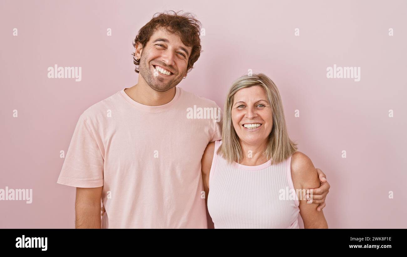 Mother and son sharing a confident, joy-filled hug, smiling together ...