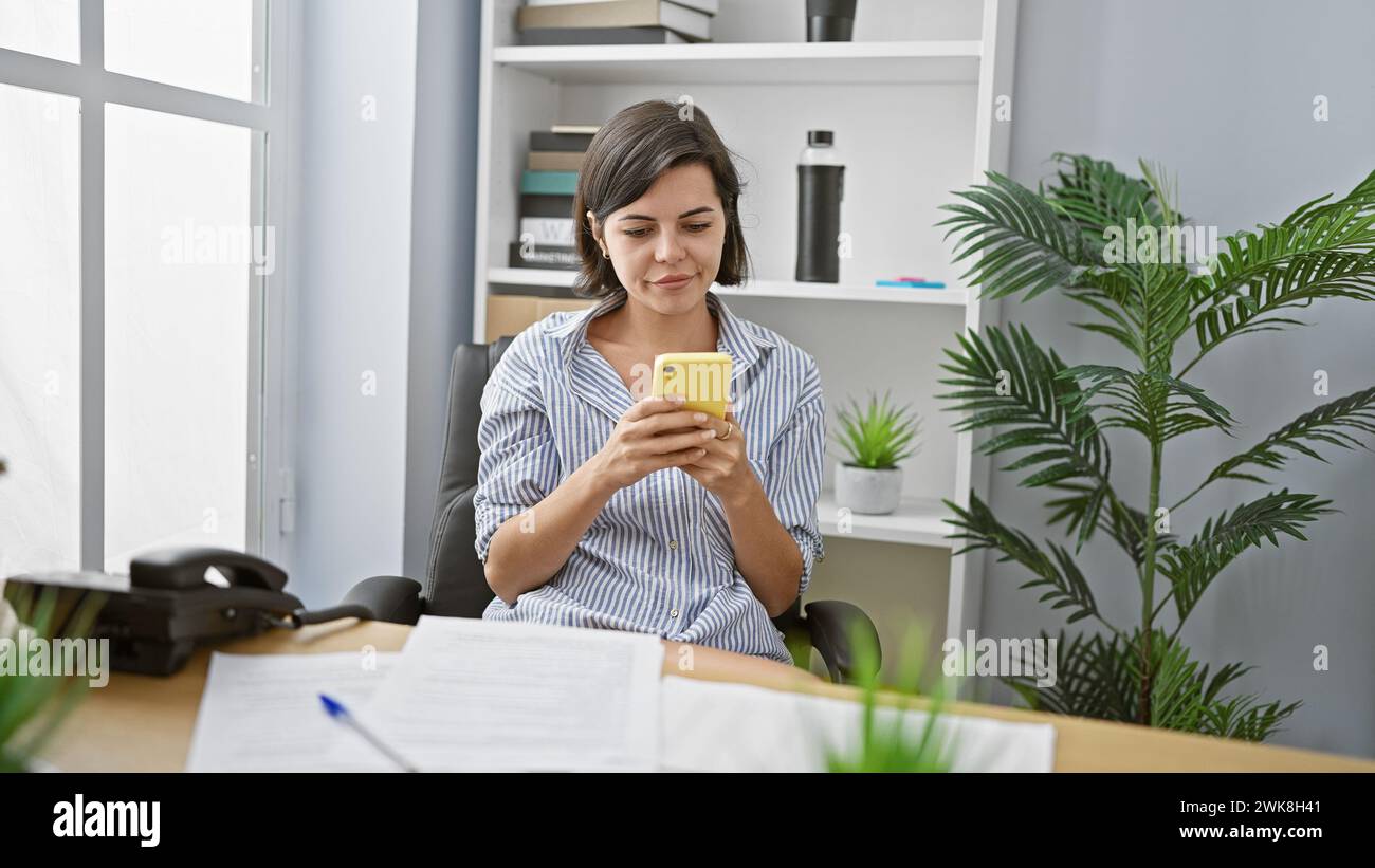 Successful young hispanic businesswoman, relaxed and concentrated ...