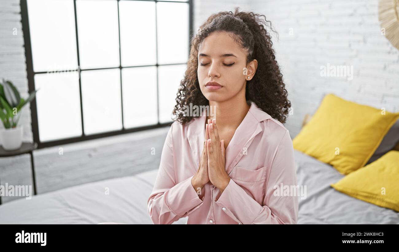 Astonishingly beautiful young hispanic woman, resting on her cozy bed ...