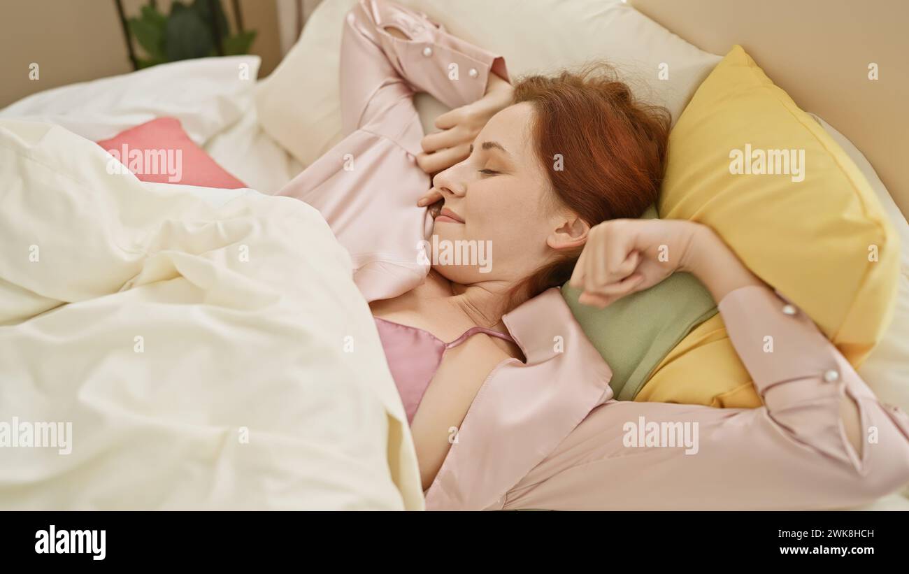 A young caucasian woman sleeps peacefully in a bedroom, surrounded by ...