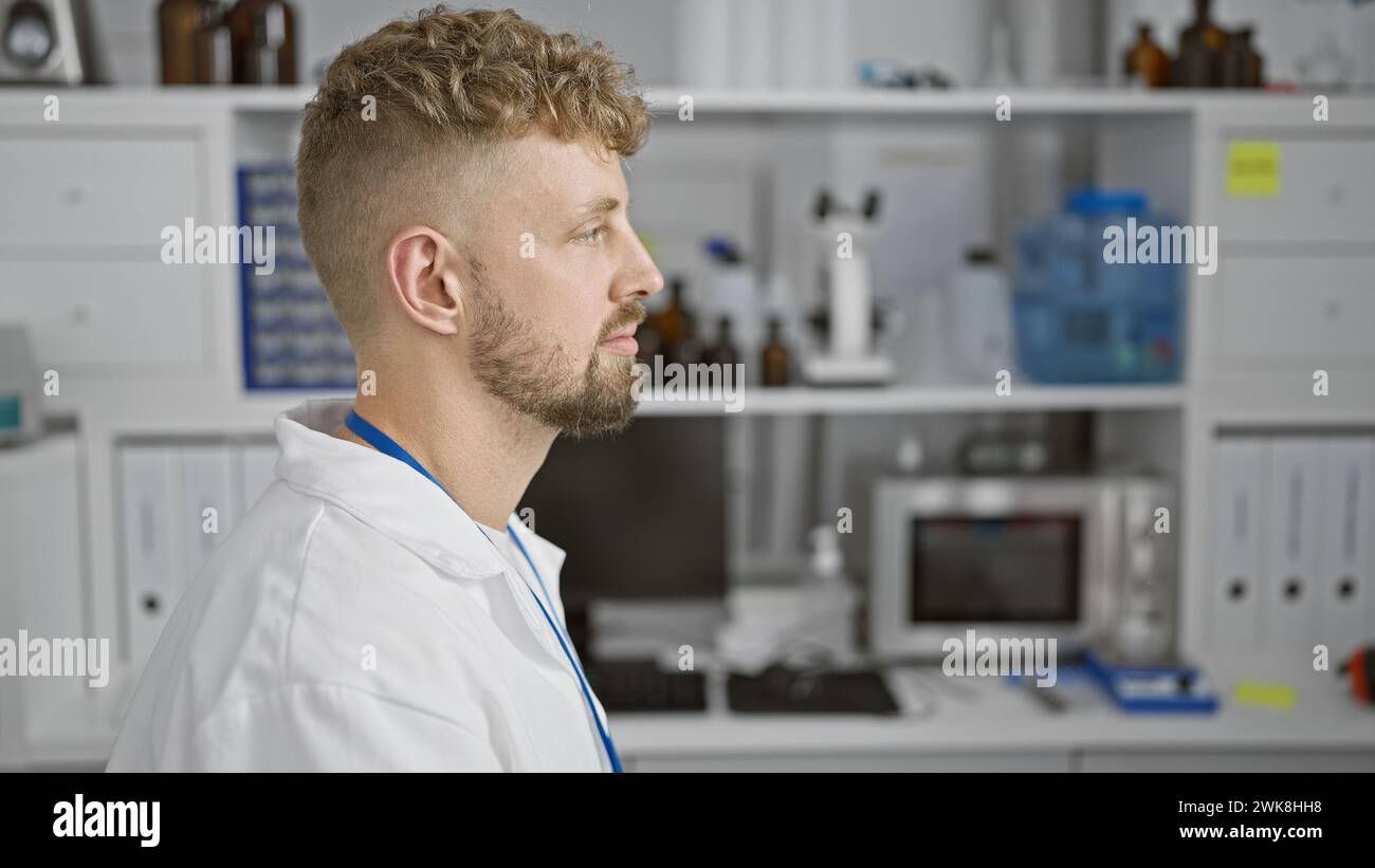 Caucasian man with beard and blue eyes wearing a lab coat in an indoor laboratory setting Stock ...