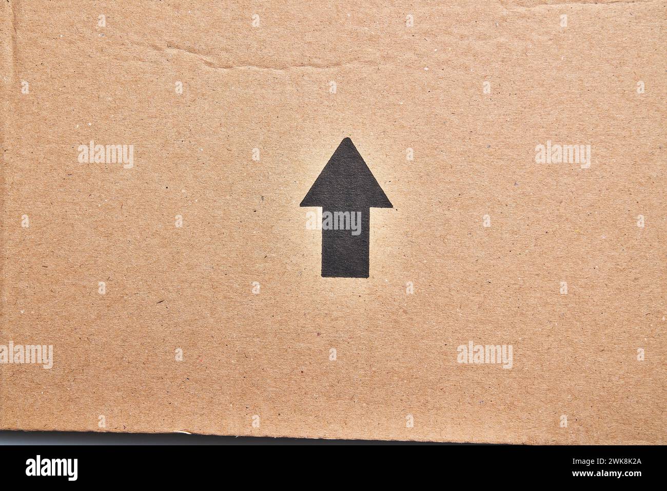 Brown cardboard carton material with arrow texture background Stock ...
