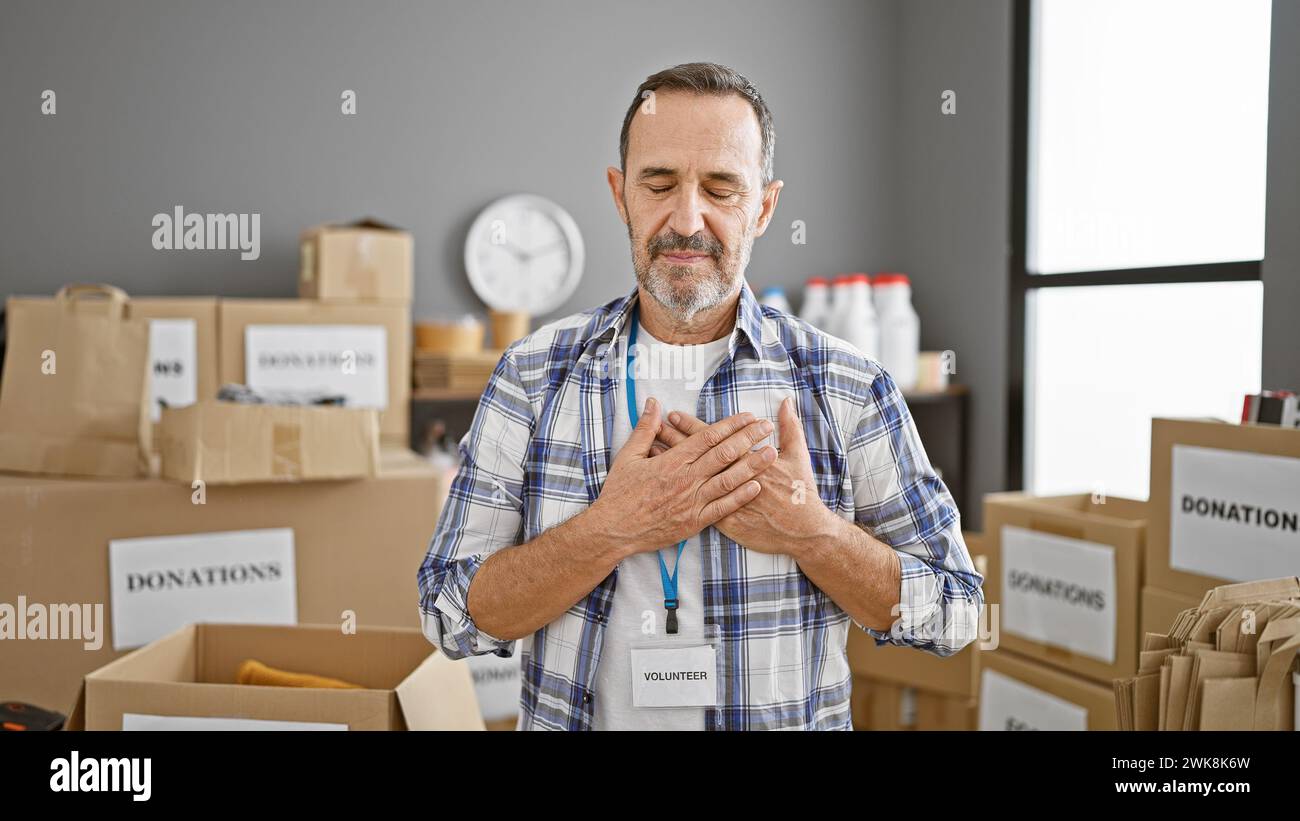 Selfless middle-aged man with grey hair volunteering his heart and ...