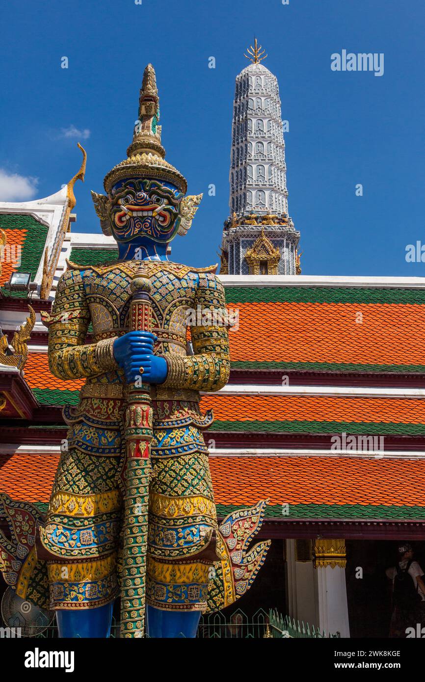 A yaksha guardian statue at the Temple of the Emerald Buddha complex in ...