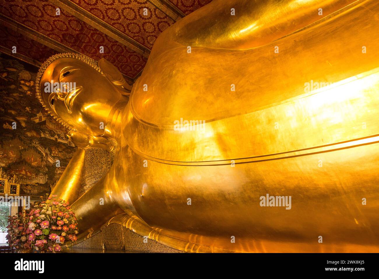 The giant Reclining Buddha statue, gilded with gold leaf, in the Wat Pho Temple in Bangkok ...