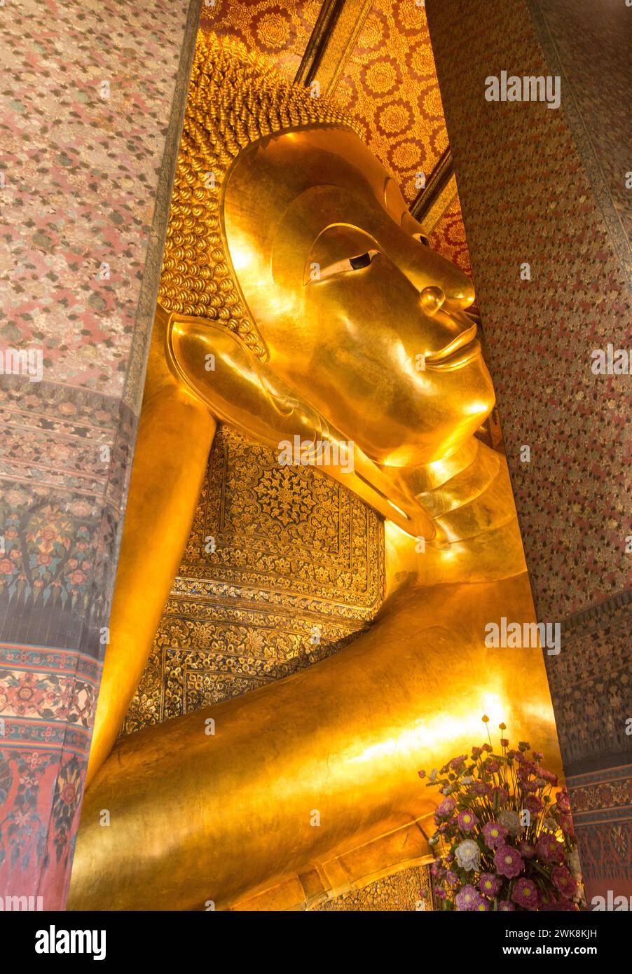 The giant Reclining Buddha statue, gilded with gold leaf, in the Wat Pho Temple in Bangkok ...
