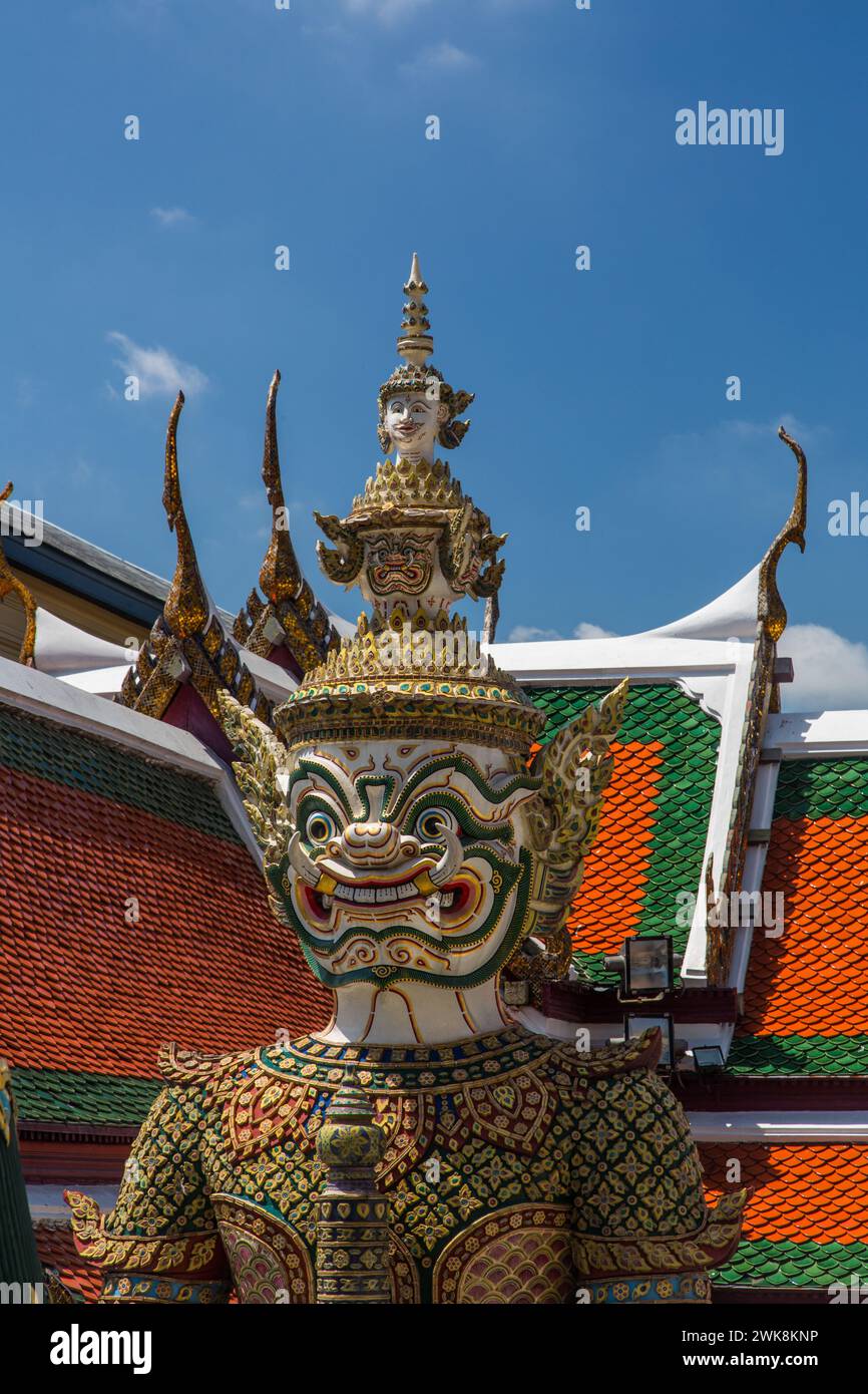 A yaksha guardian statue at the Temple of the Emerald Buddha complex in ...
