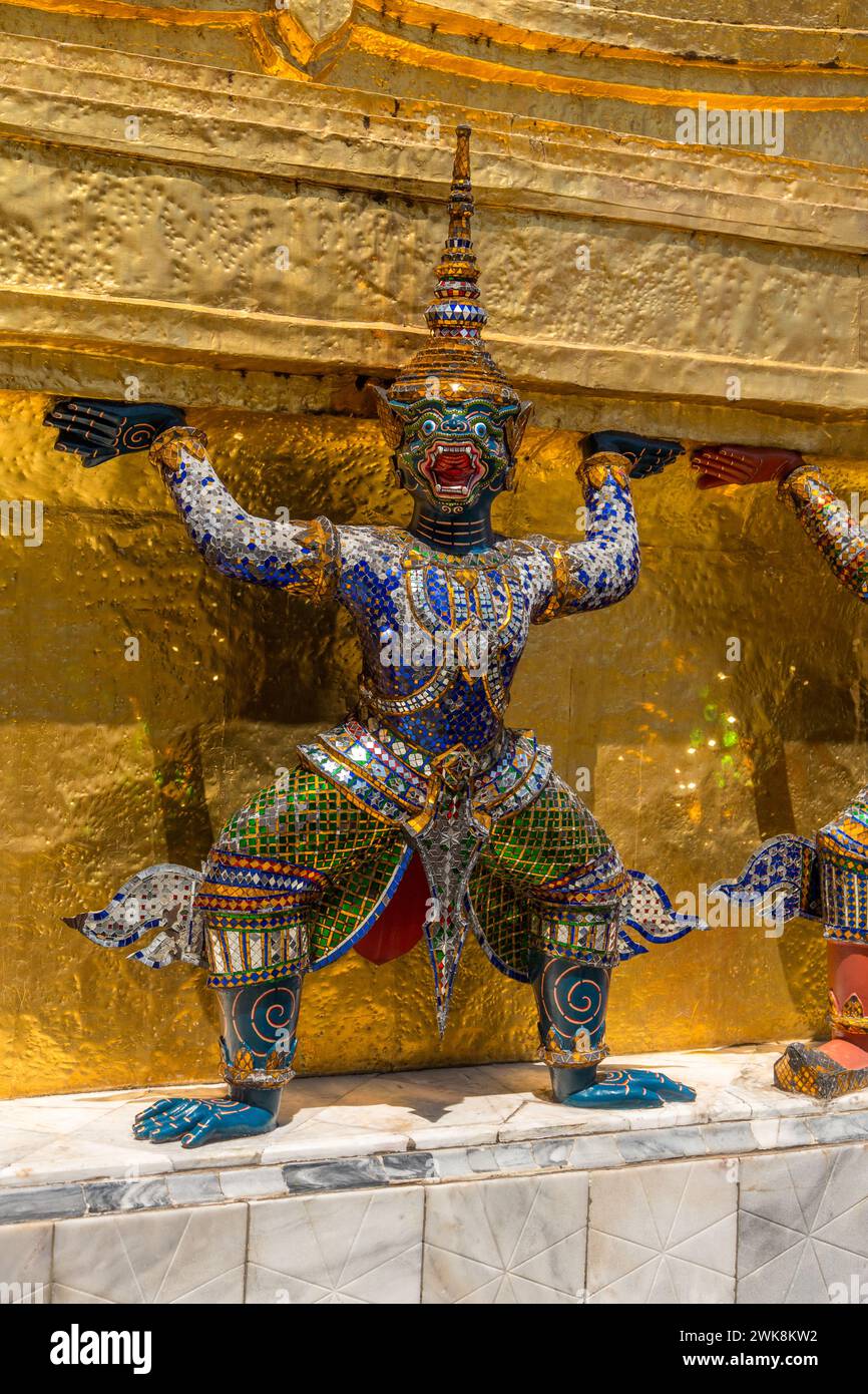 A small yaksha guardian statue at the Temple of the Emerald Buddha ...