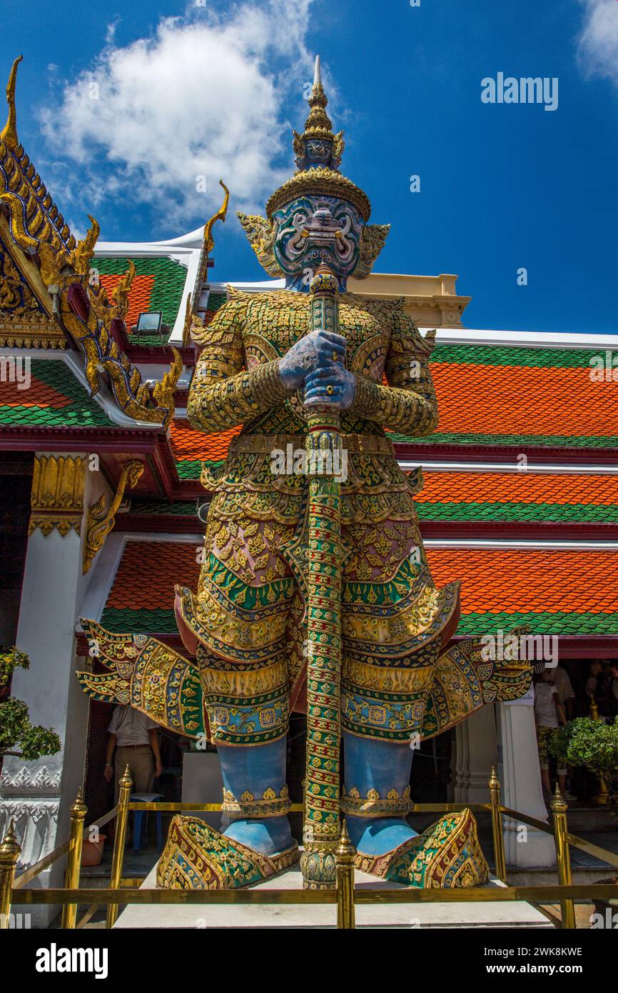 A yaksha guardian statue at the Temple of the Emerald Buddha complex in ...
