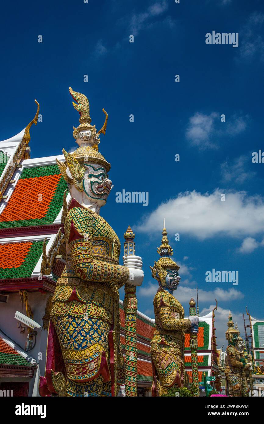 Yaksha guardian statues at the Temple of the Emerald Buddha complex in ...