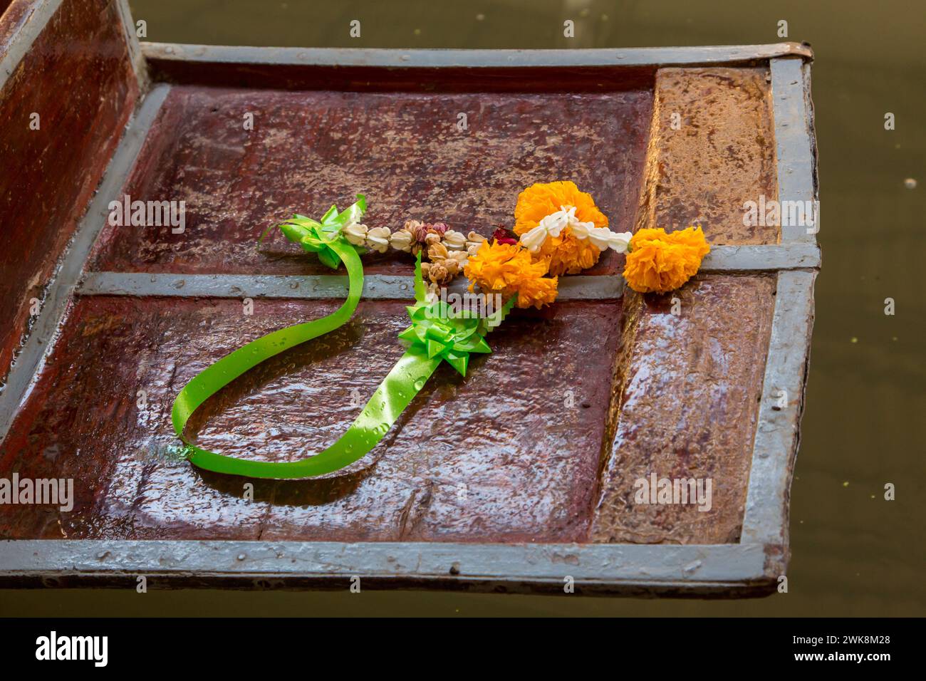 A Buddhist offering of flowers on a boat in the Damnoen Saduak Floating ...