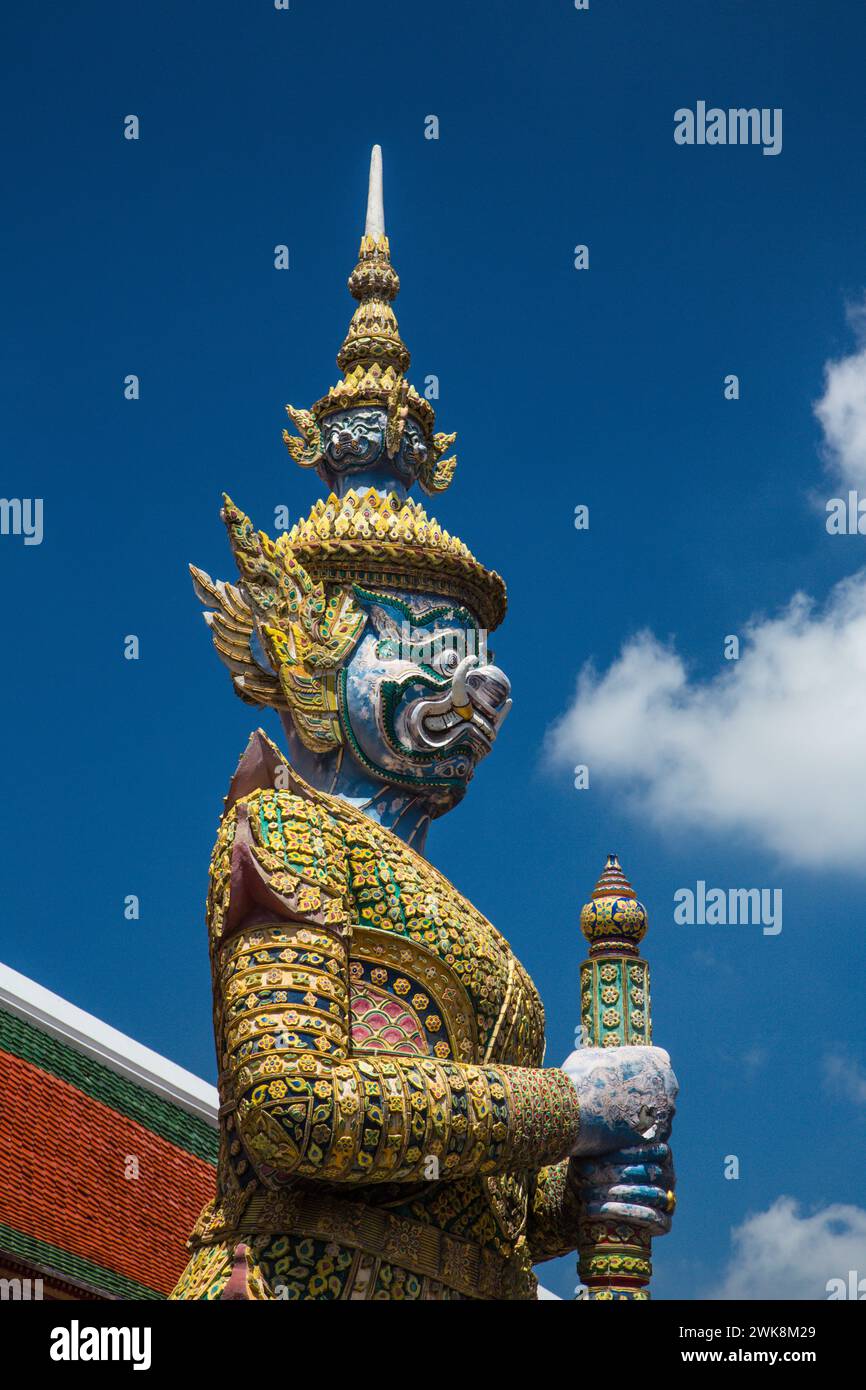 A yaksha guardian statue at the Temple of the Emerald Buddha complex in ...