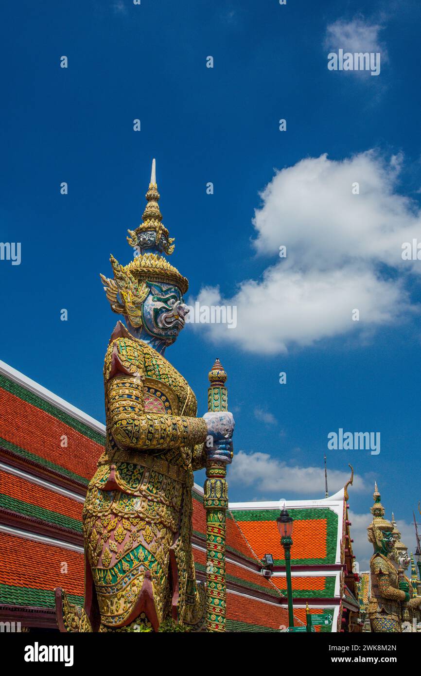 A yaksha guardian statue at the Temple of the Emerald Buddha complex in ...