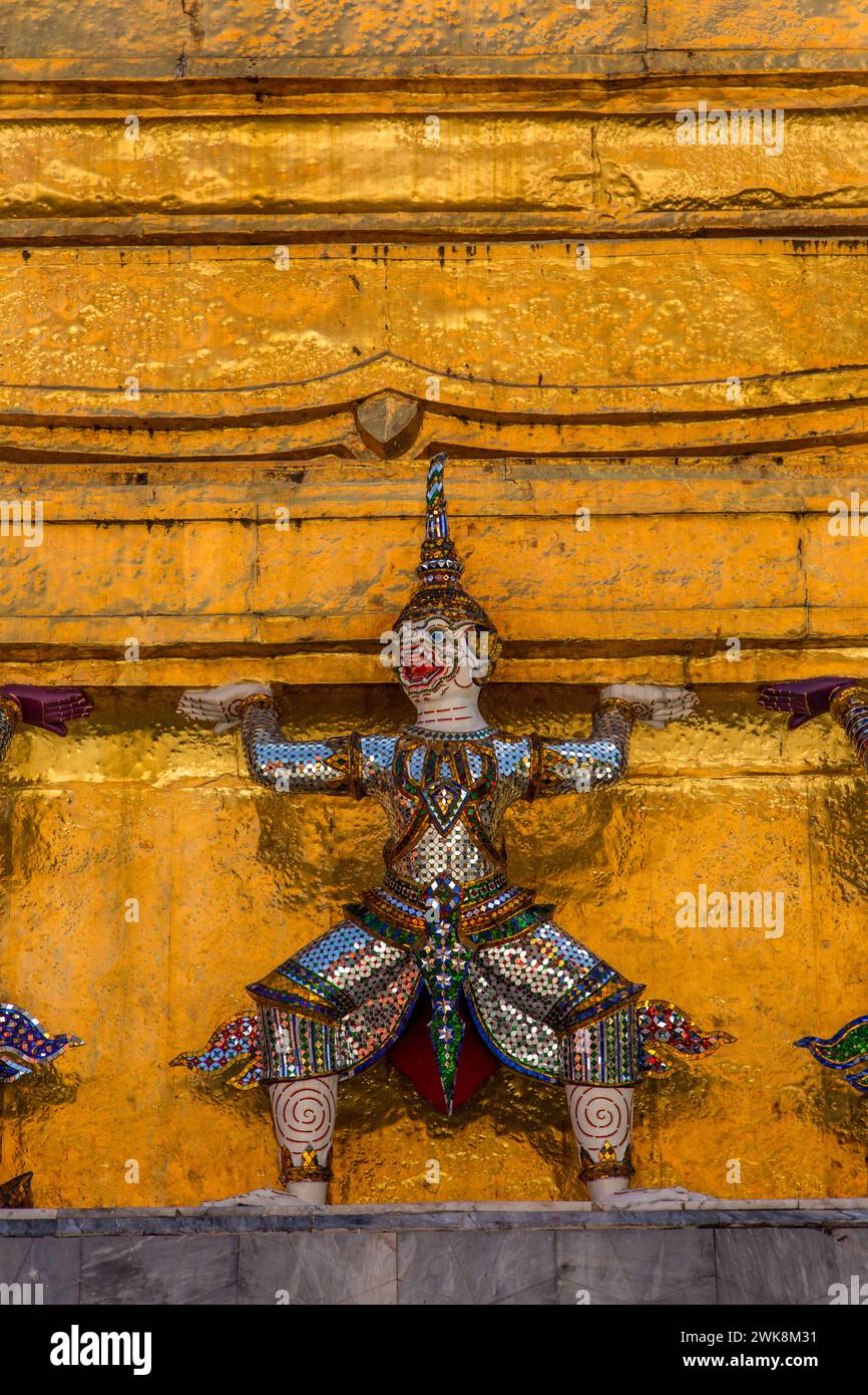 A small yaksha guardian statue at the Temple of the Emerald Buddha ...