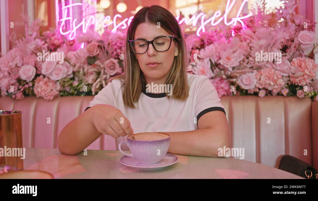 Young woman in glasses stirs hi-res stock photography and images - Alamy