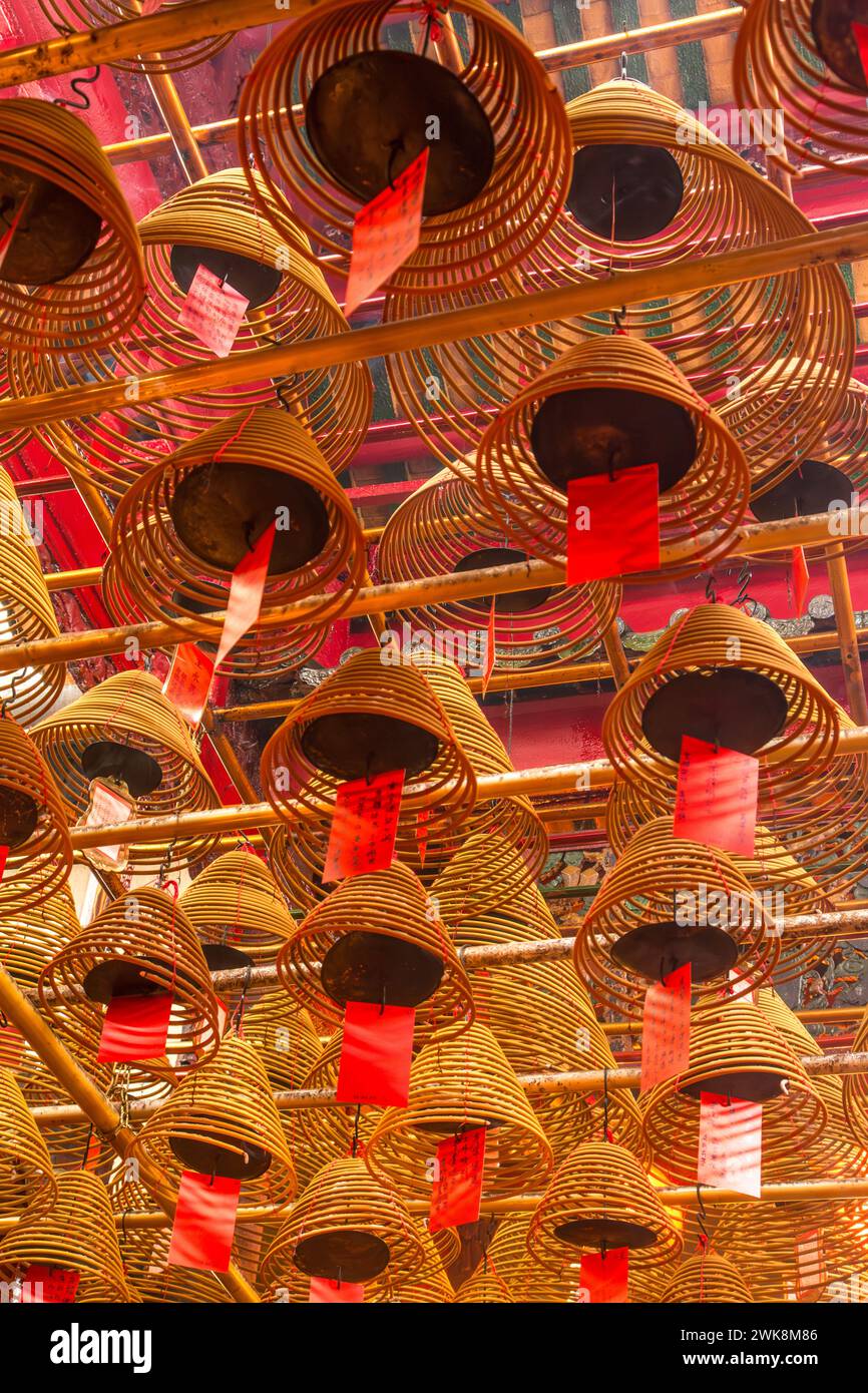 Burning incense coils send prayers to heaven in the Man Mo Temple, a ...