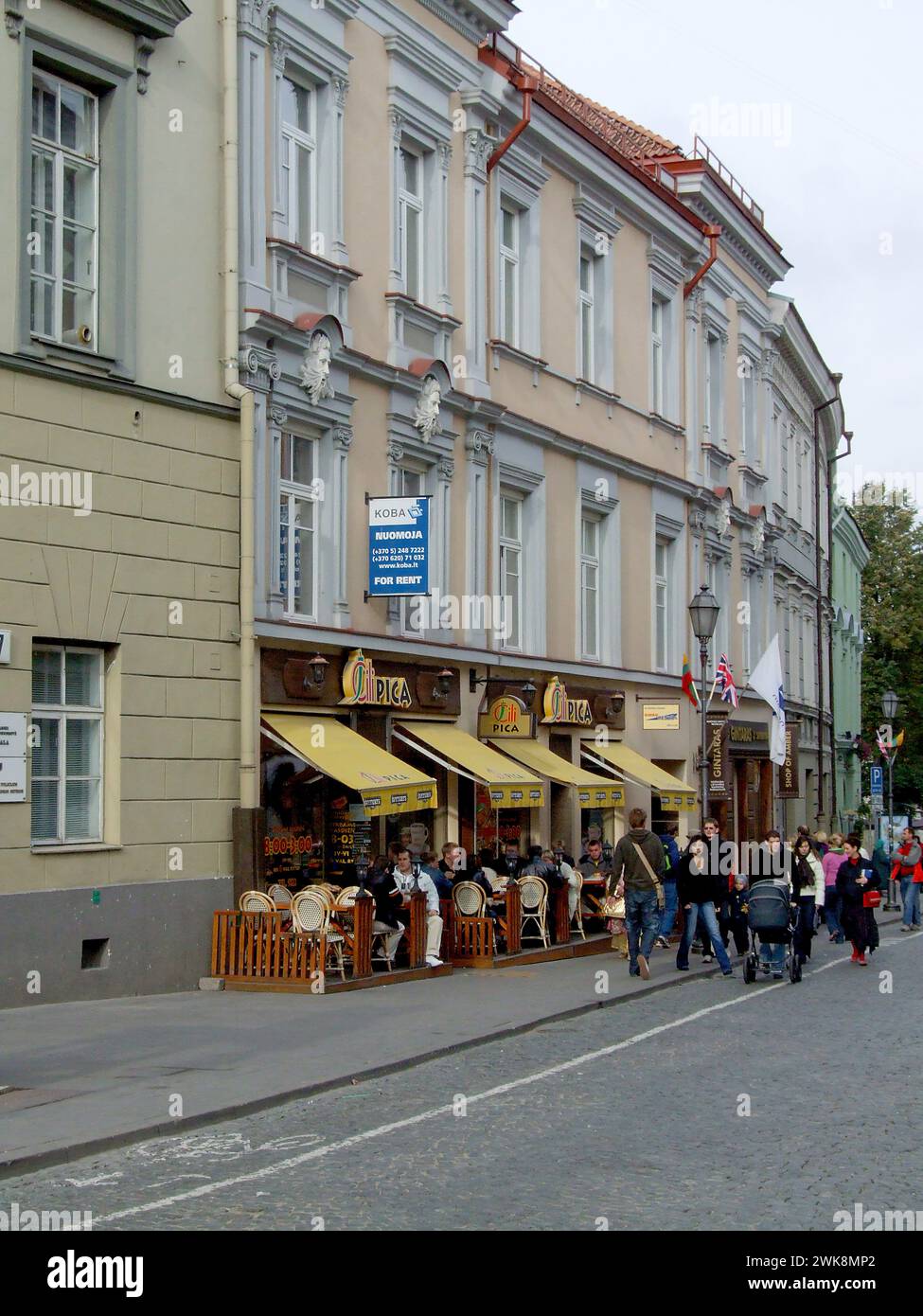 People eating in a sidewalk cafe on the street in the historic Old Town ...