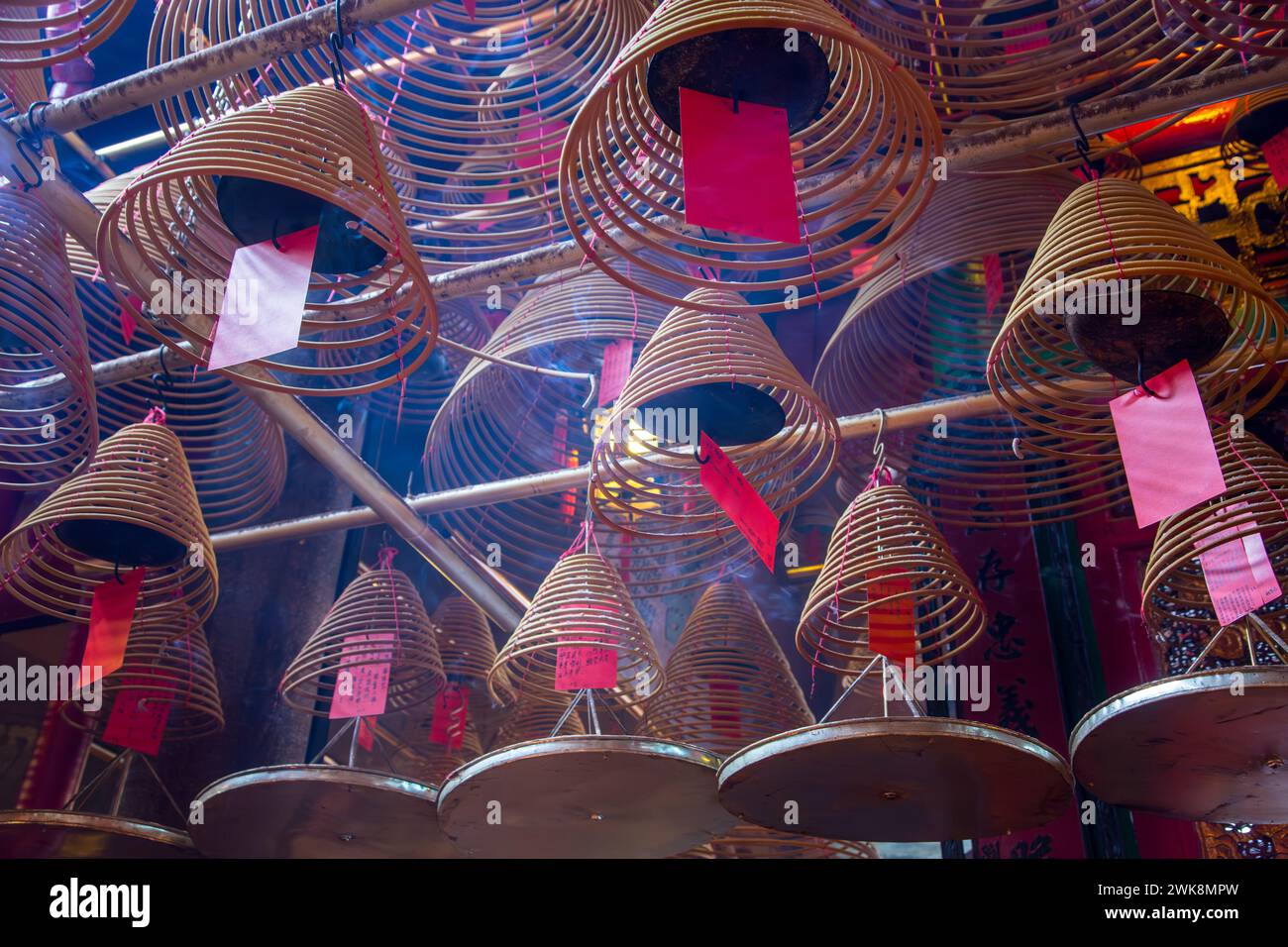 Burning incense coils send prayers to heaven in the Man Mo Temple, a ...