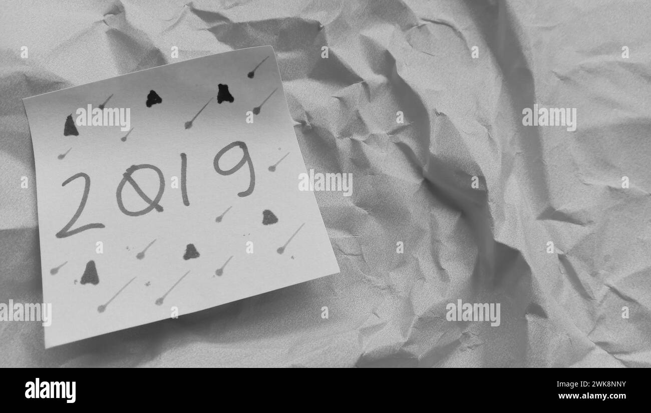 Photo of business and money-themed object with text in the note that ...