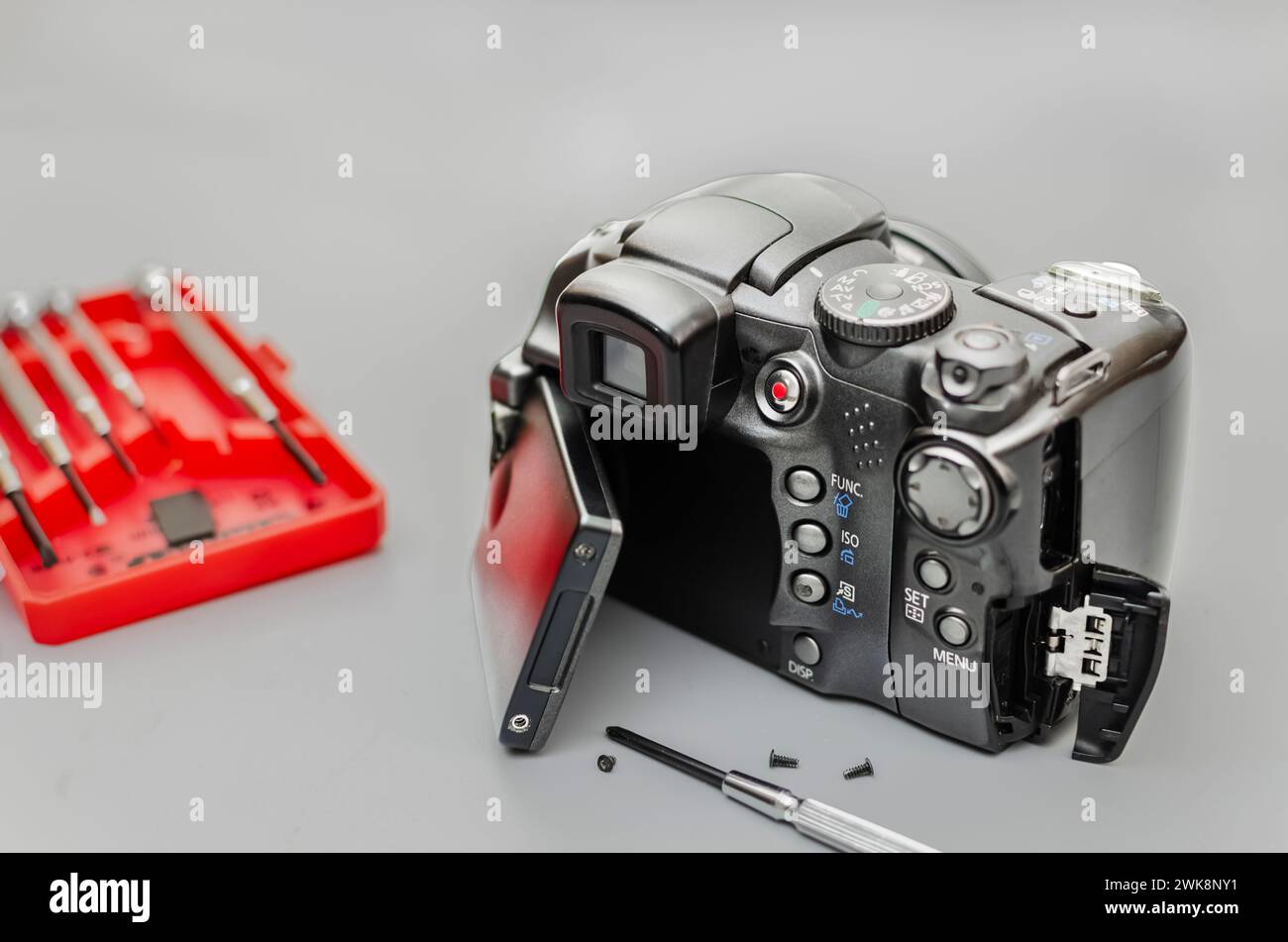 Disassembling of photo camera, close-up. Photographing equipment ...