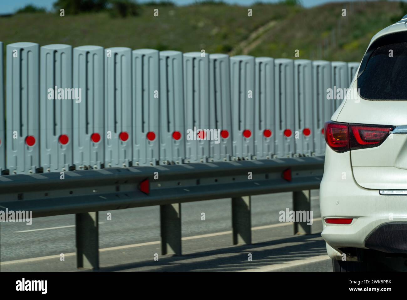 Safety barriers on highway. Anodized safety steel barrier. Enhancing ...