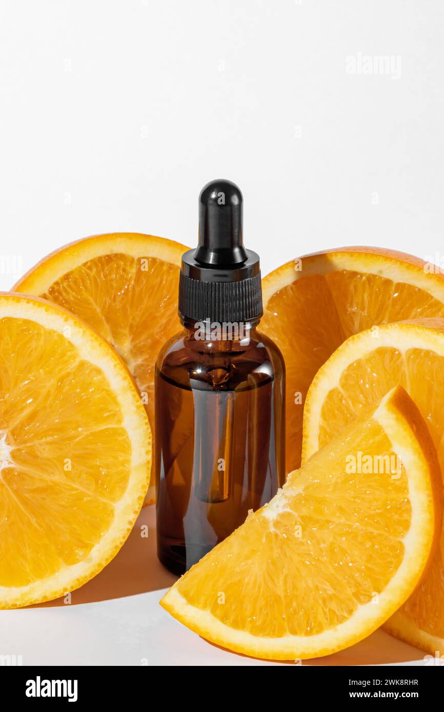 Serum in amber glass dropper bottle and cosmetics with vitamin C ...